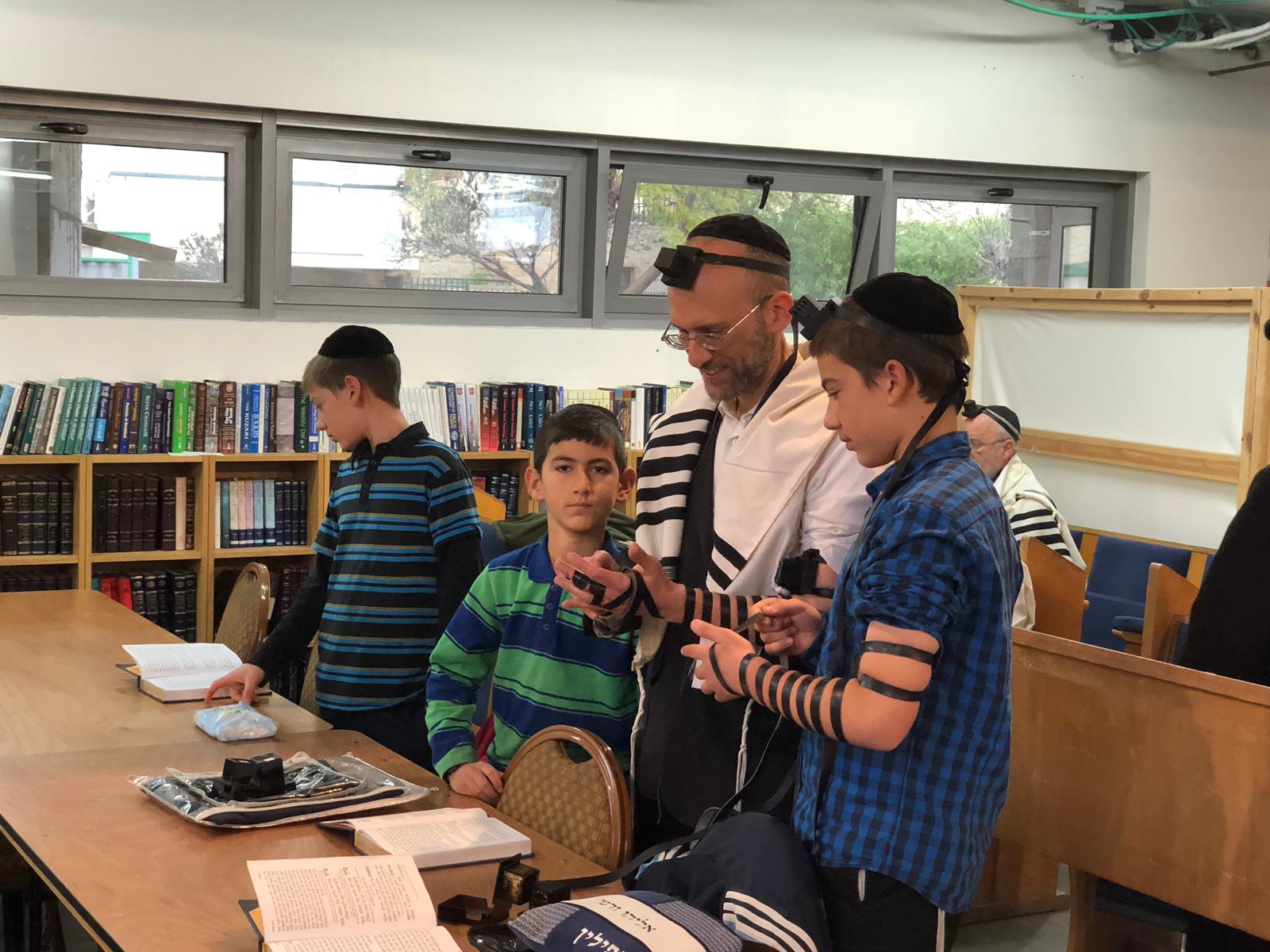 Ds12 putting on tefillin for the first time! - Avivah Werner